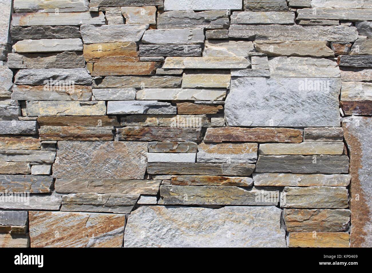 Attractive stone wall comprised of desert quartz bricks of varying ...
