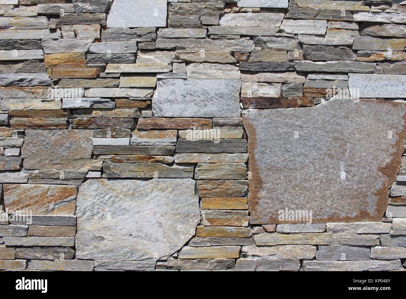 Attractive stone wall comprised of desert quartz bricks of varying ...