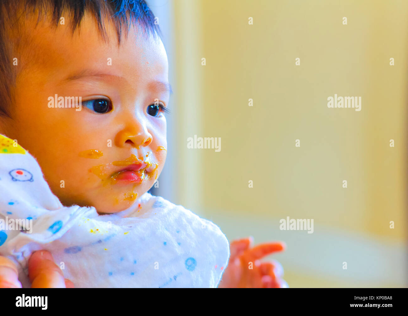 happy eating : little asian boy enjoys eating food Stock Photo - Alamy