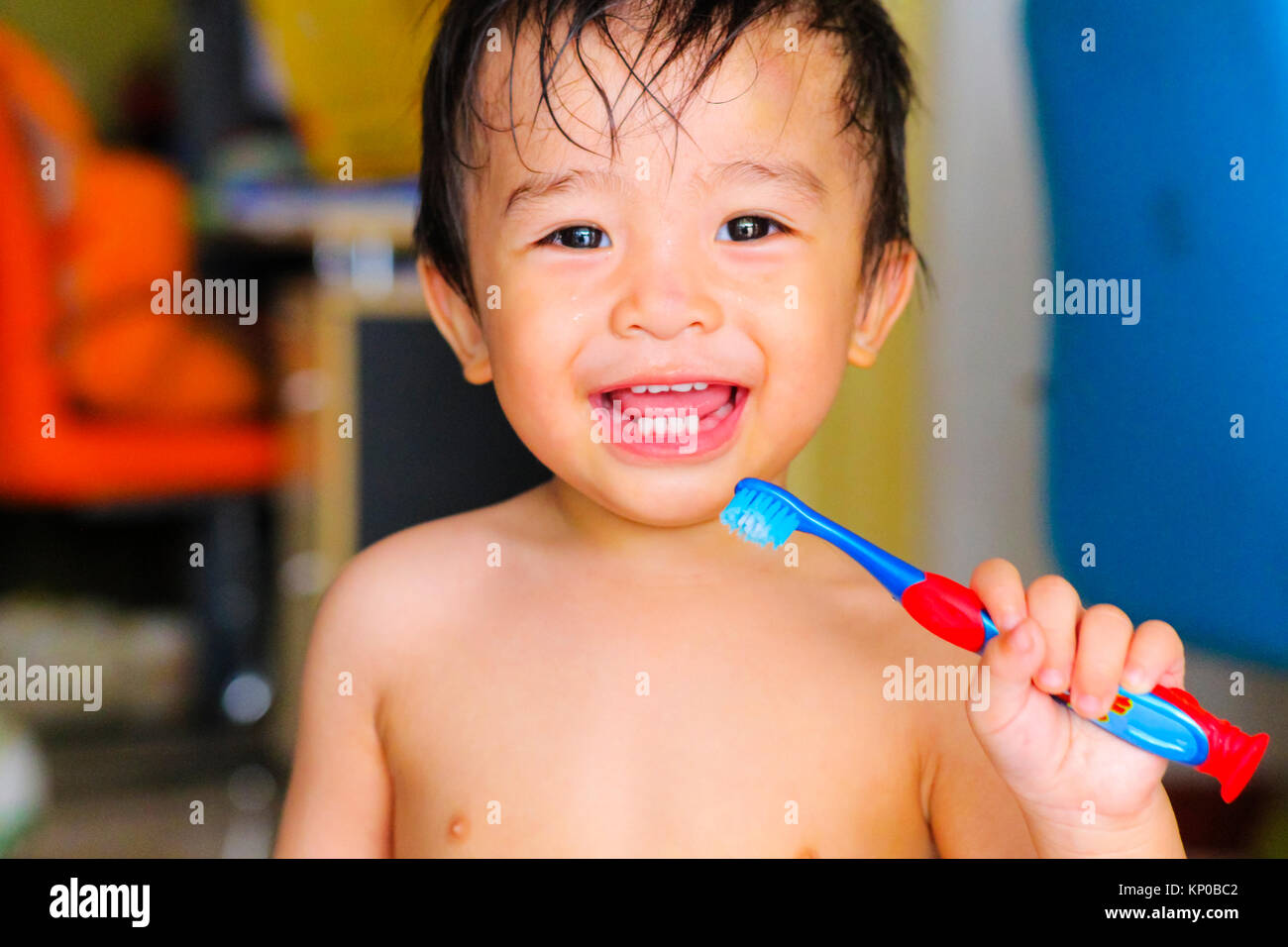 kid boy brushing teeth and smiling Stock Photo - Alamy