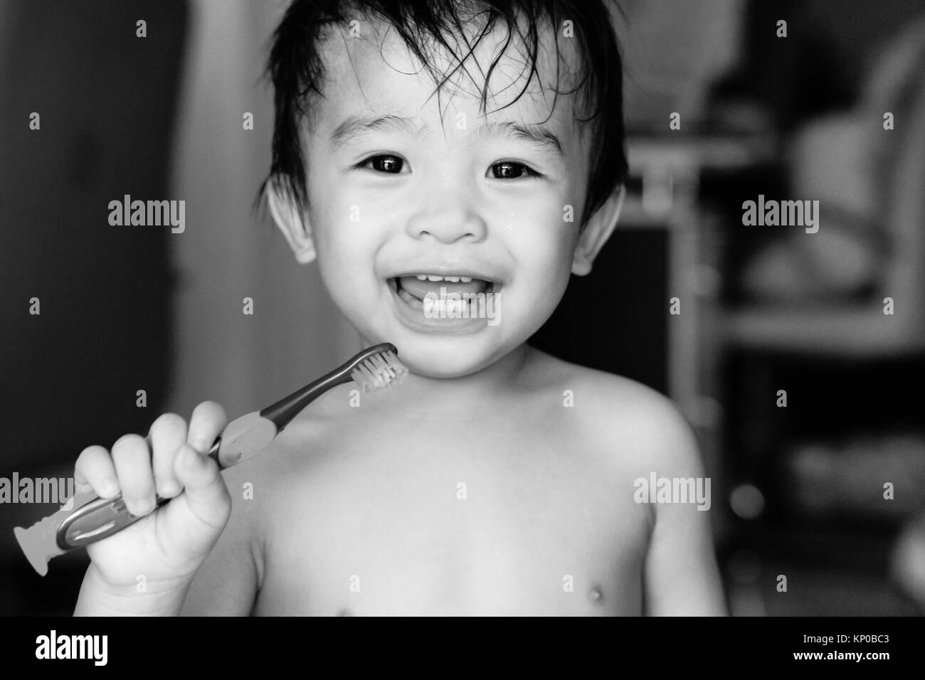 kid boy brushing teeth and smiling Stock Photo - Alamy