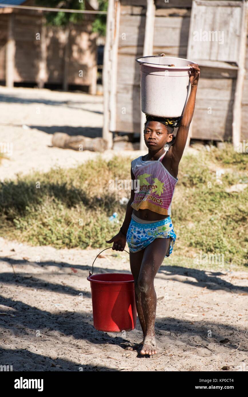 African carrying water bucket hi-res stock photography and images - Alamy