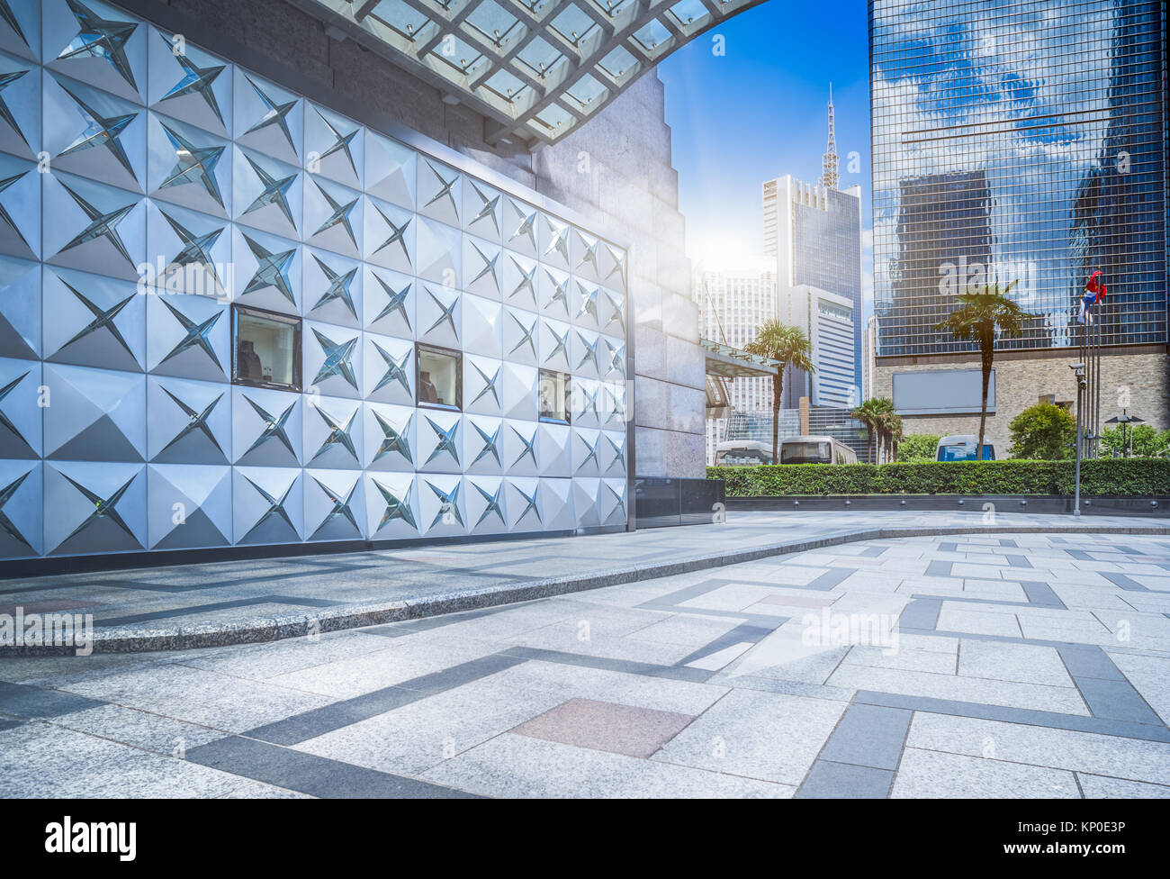empty brick floor with modern building in background Stock Photo - Alamy