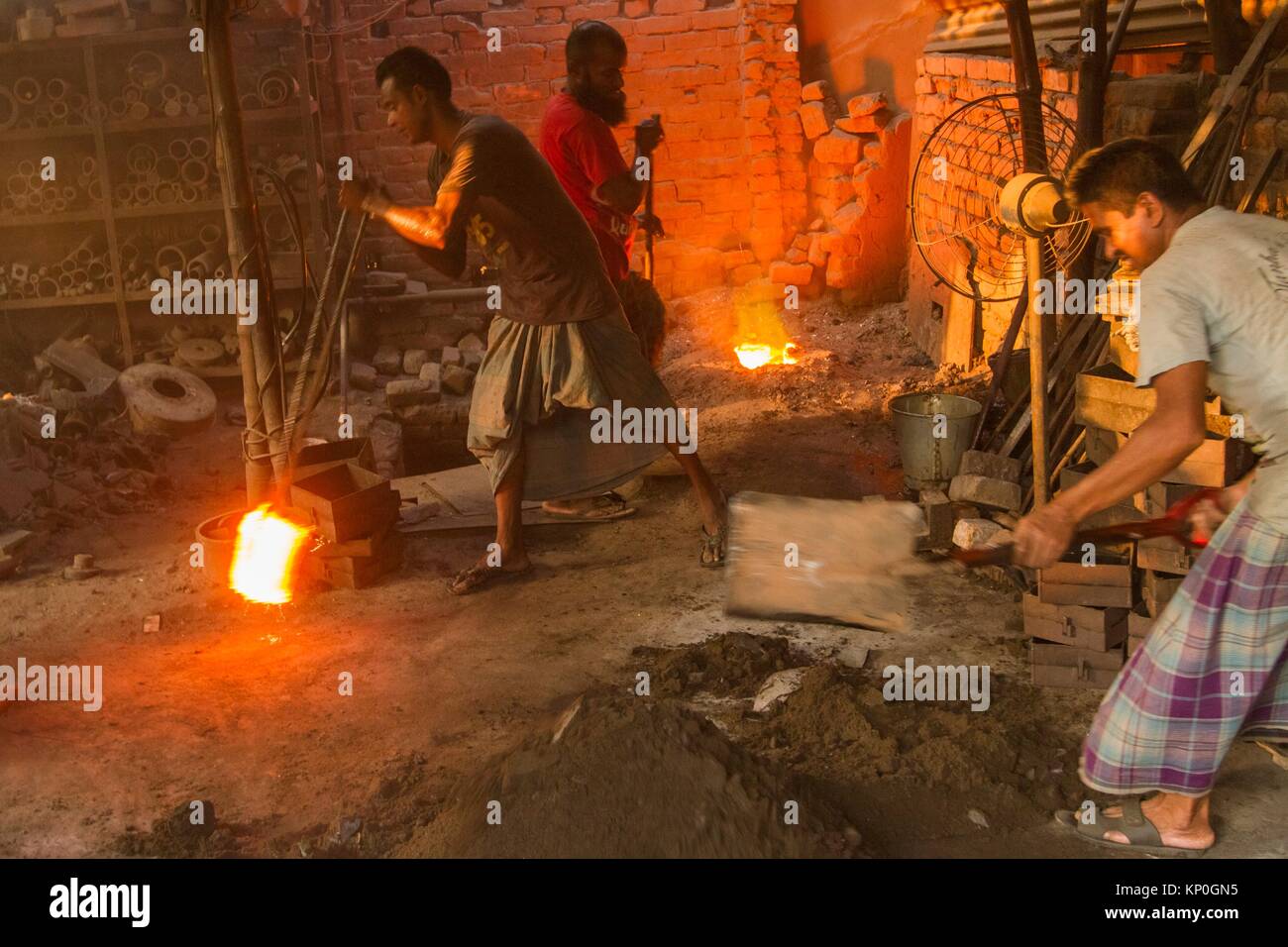 Bangladeshi laborer works at molding factory near old Dhaka. Workers ...