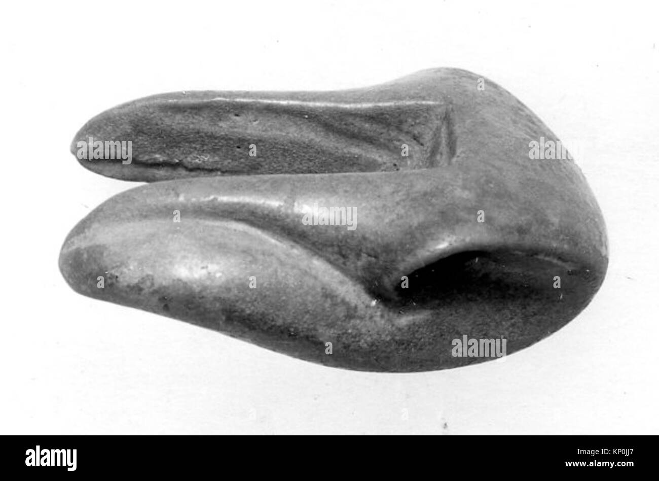 Metal cobra head from an architectural frieze, functioning as a ...