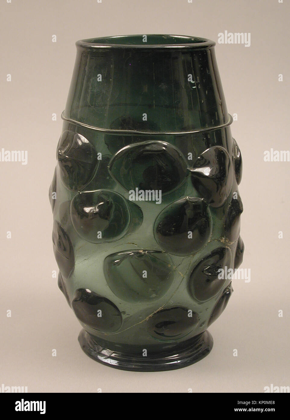 A 13th-century Syrian glass beaker, attributed to Syria, measuring 4 1/ ...