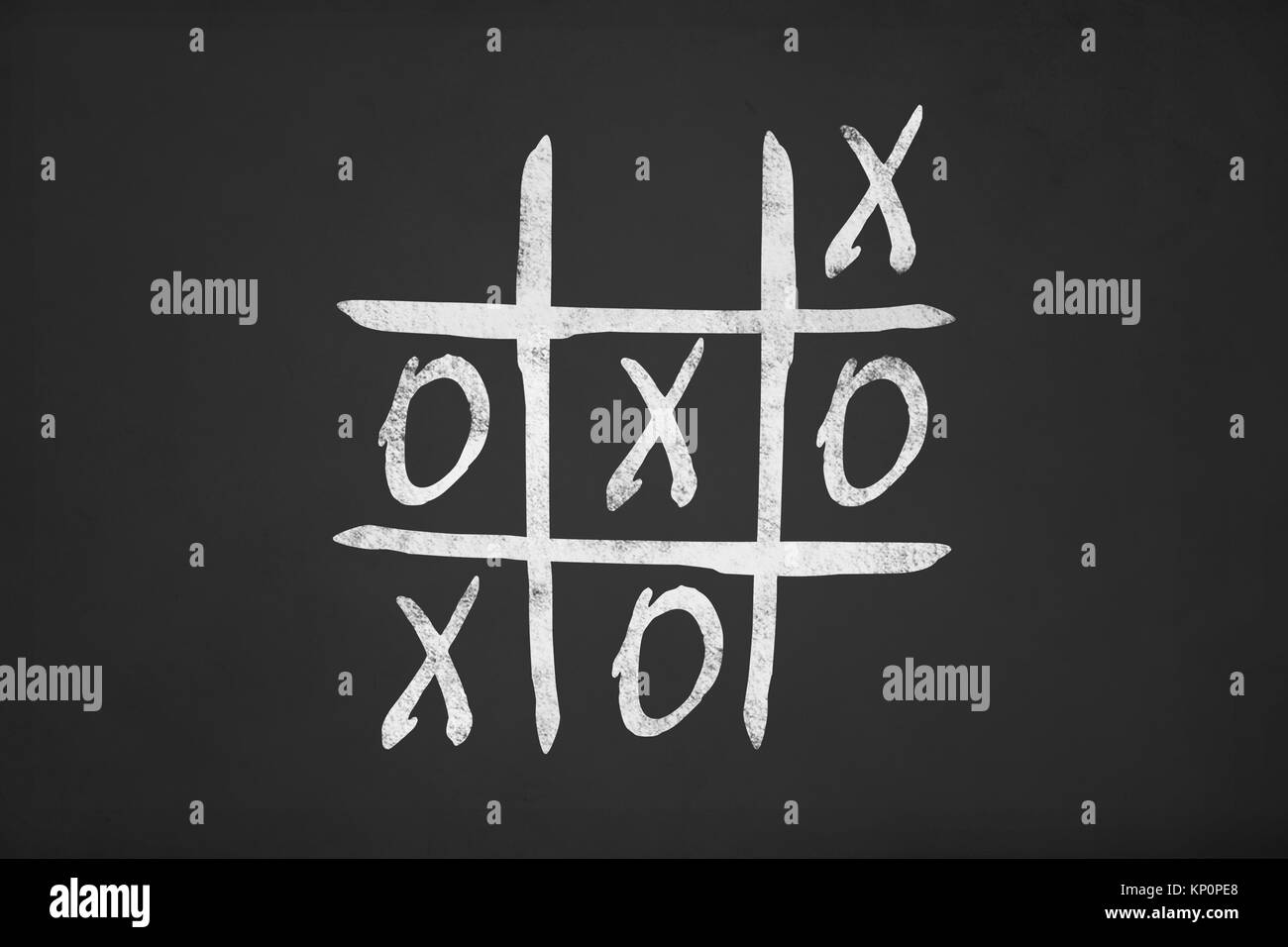 Illustrative white tic tac toe game image on black chalk board ...