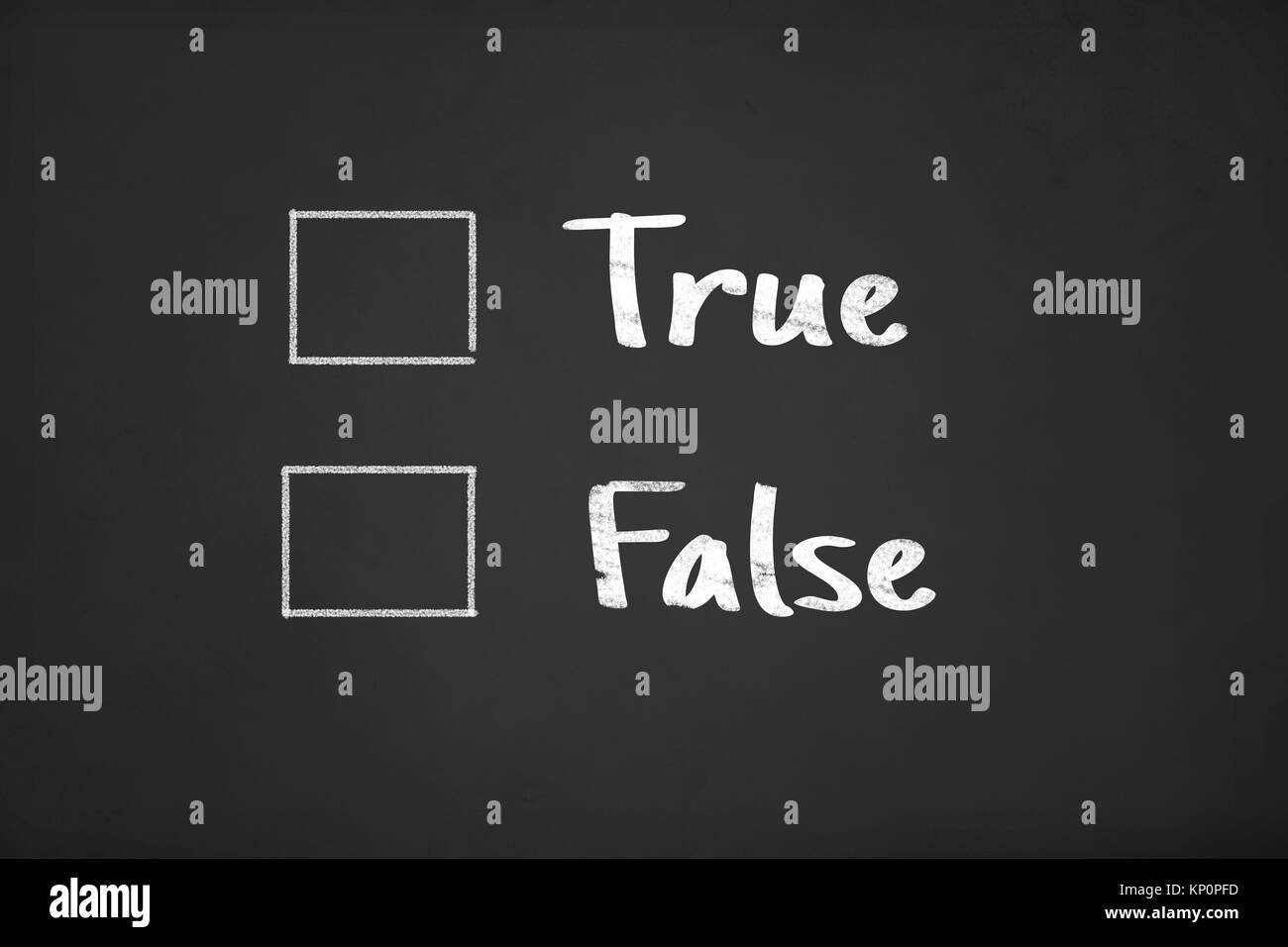 Illustrative white true false word and tick box on black chalk board ...