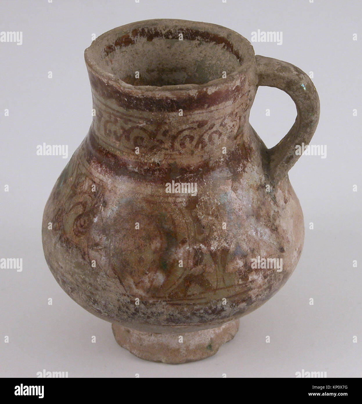This ceramic ewer displays material, shape, and decorative features ...