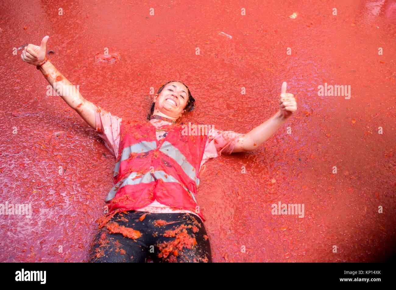 Young people enjoying the Tomatina, the world´s largest tomato fight ...