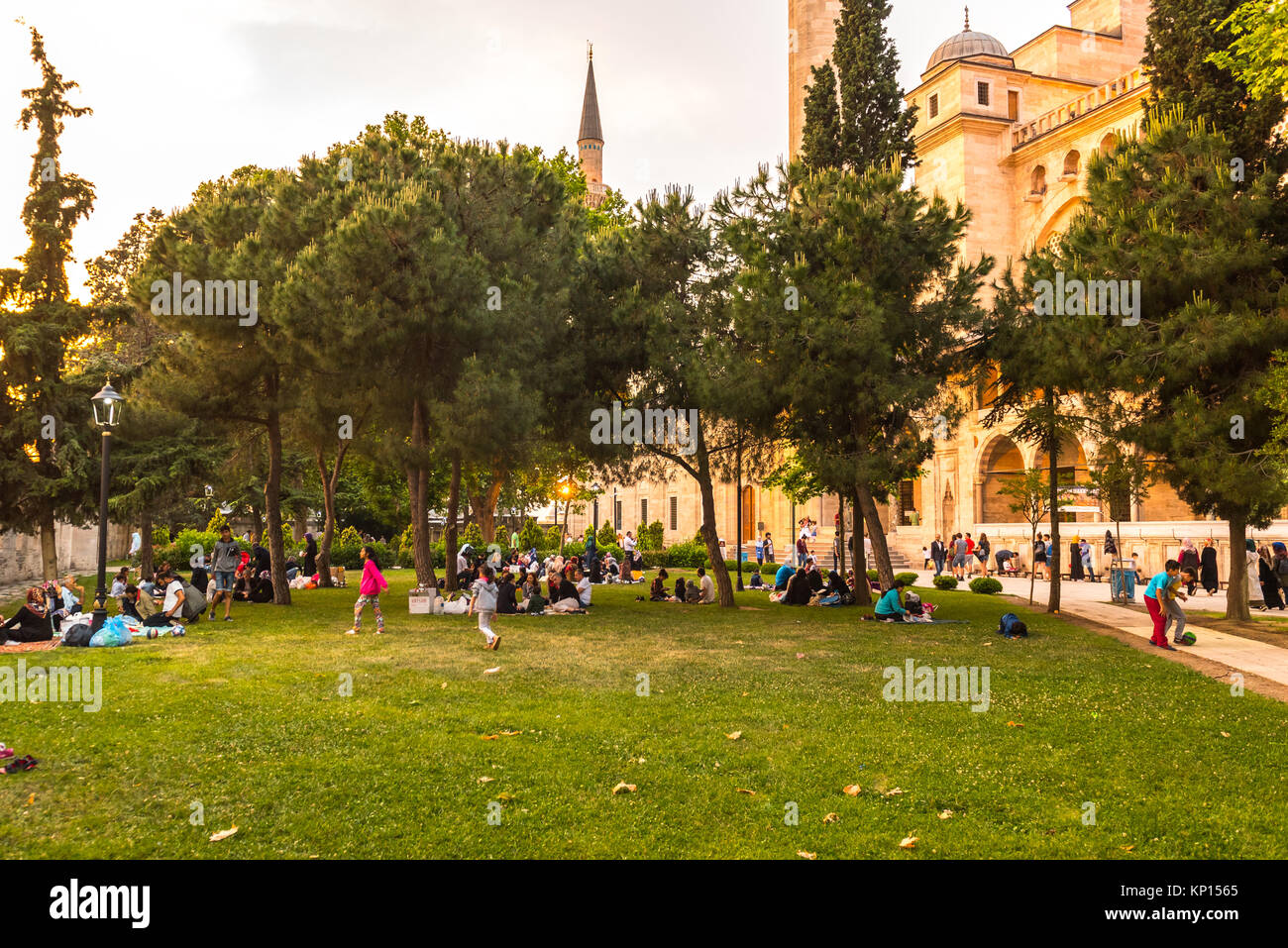 Muslim people who are fasting wait for adhan (ezan) and evening meal ...