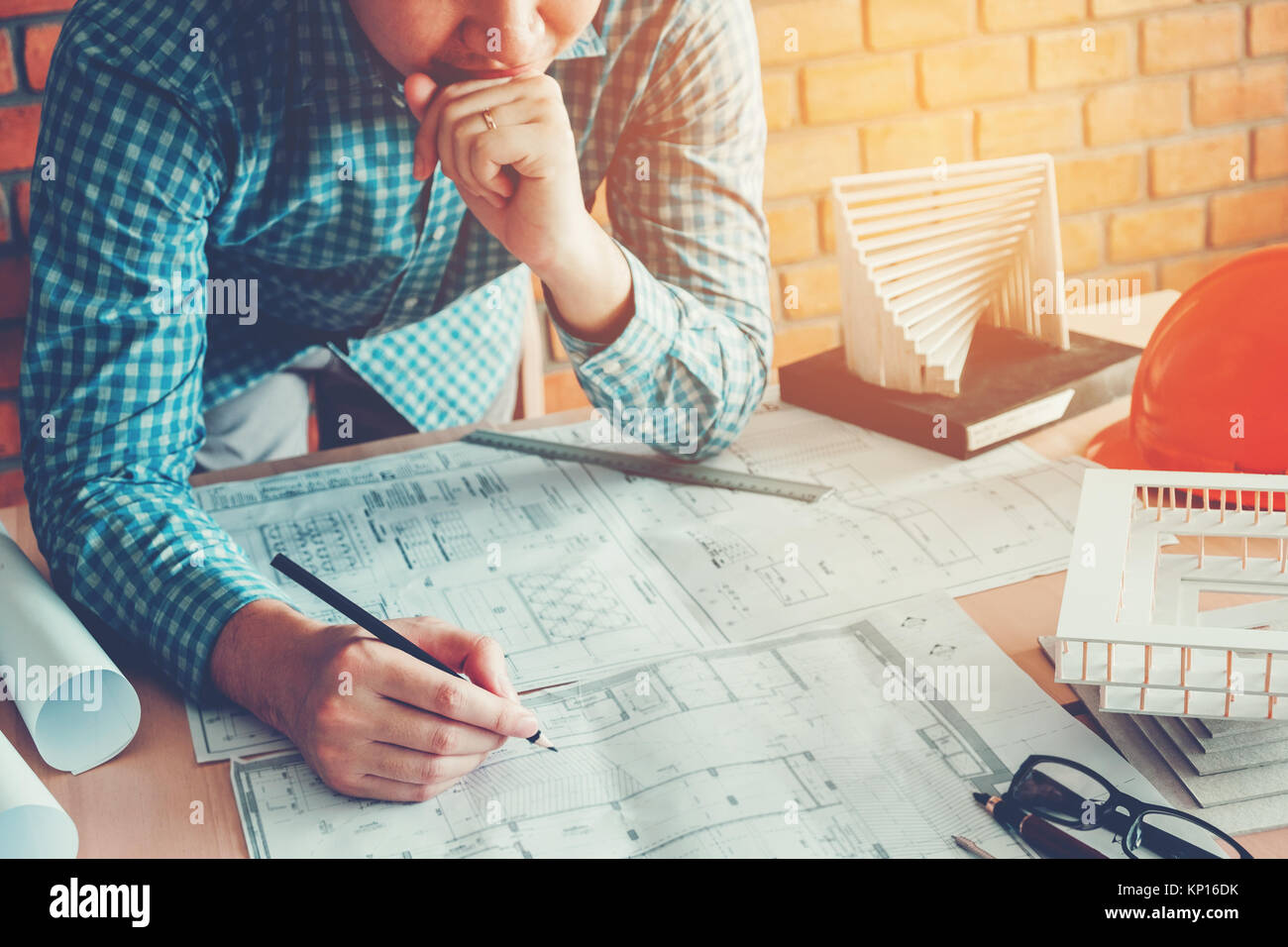 Architect or engineer working in office on blueprint. Architects ...