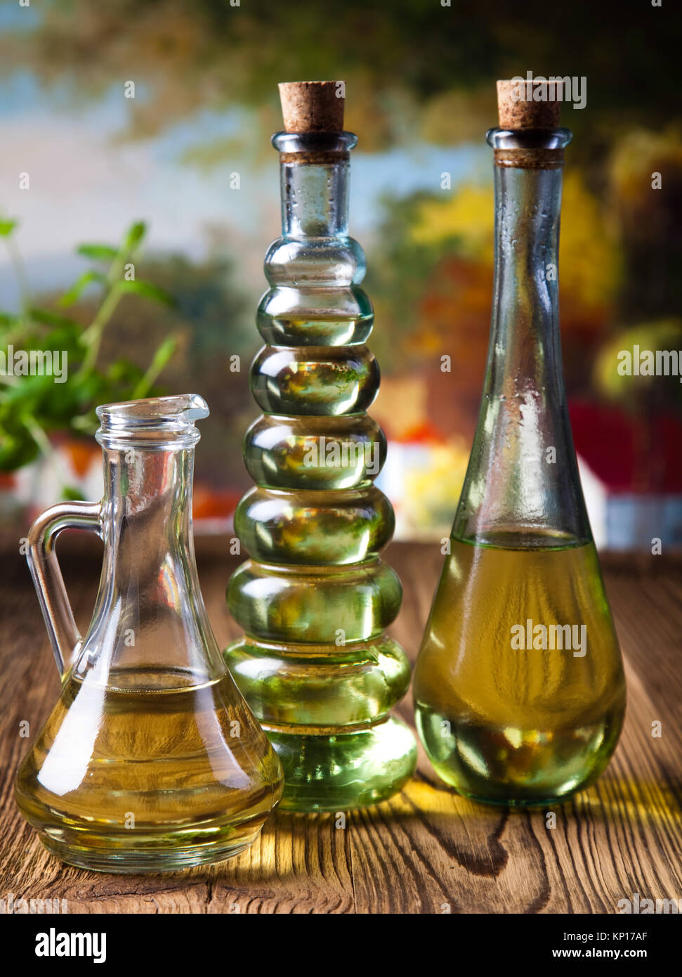 Olive oils in bottles, Mediterranean rural theme Stock Photo - Alamy