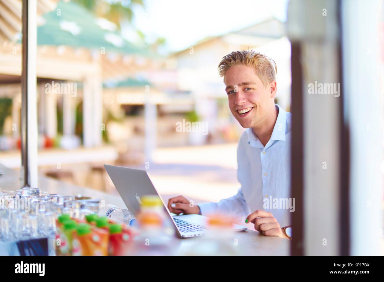 young business man with laptop computer sitting at bar Stock Photo - Alamy
