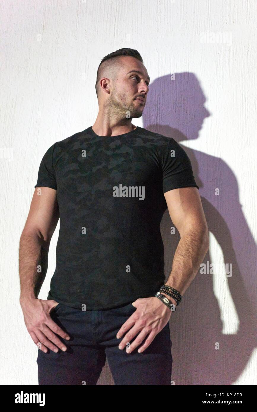 portrait of young man looking away. Half Greek and half English ...