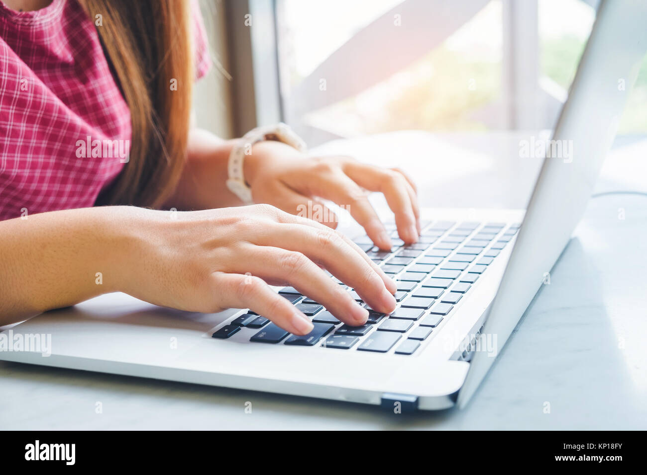 Woman using laptop computer. Female working on laptop in an outdoor ...