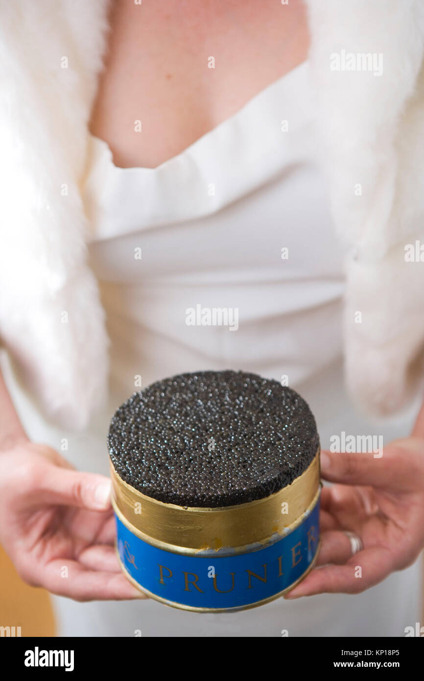 Young woman eating caviar hi-res stock photography and images - Alamy
