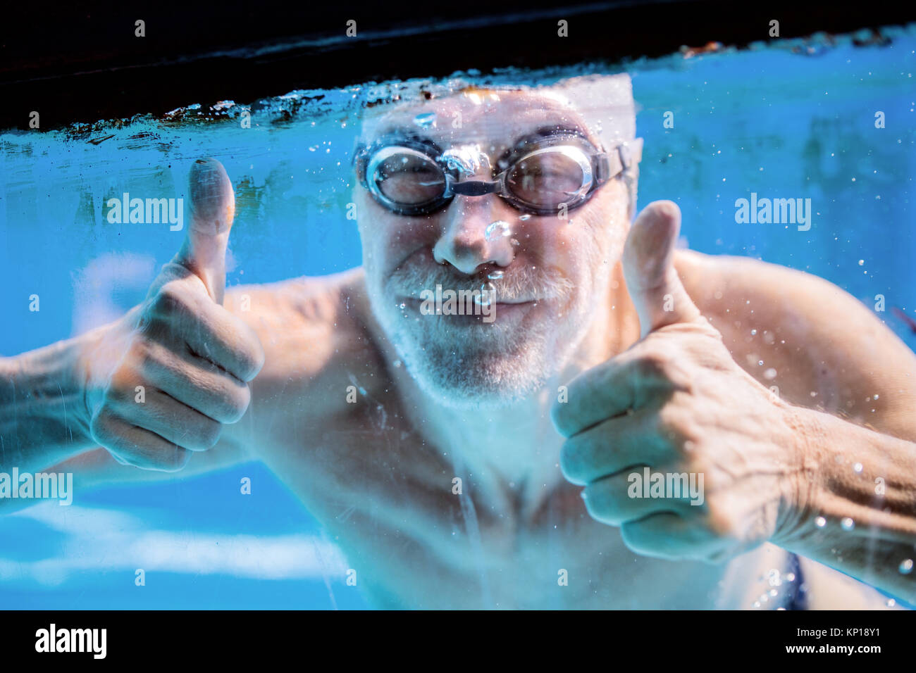 Old man swimming underwater hi-res stock photography and images - Alamy