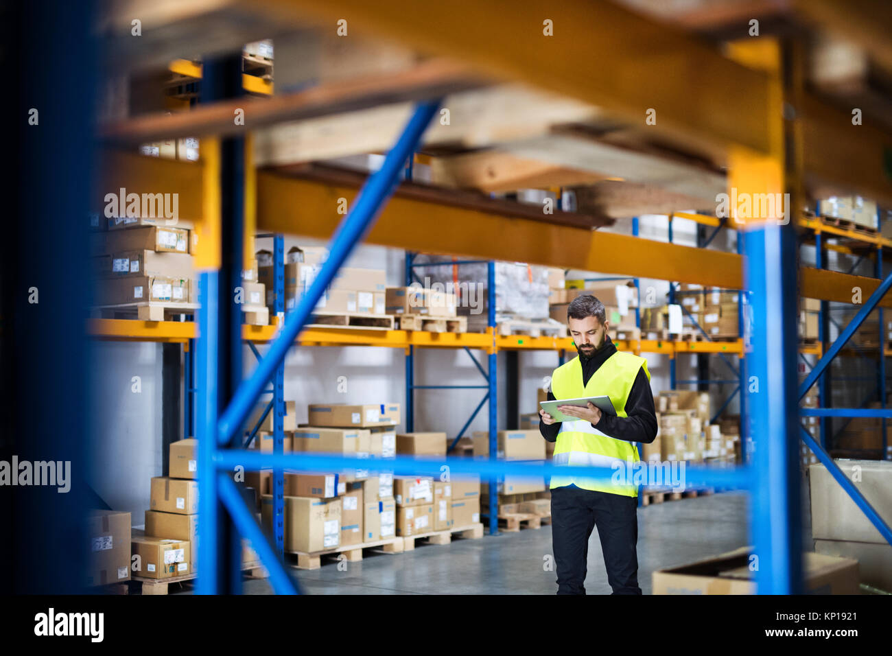 Male warehouse worker with tablet Stock Photo - Alamy