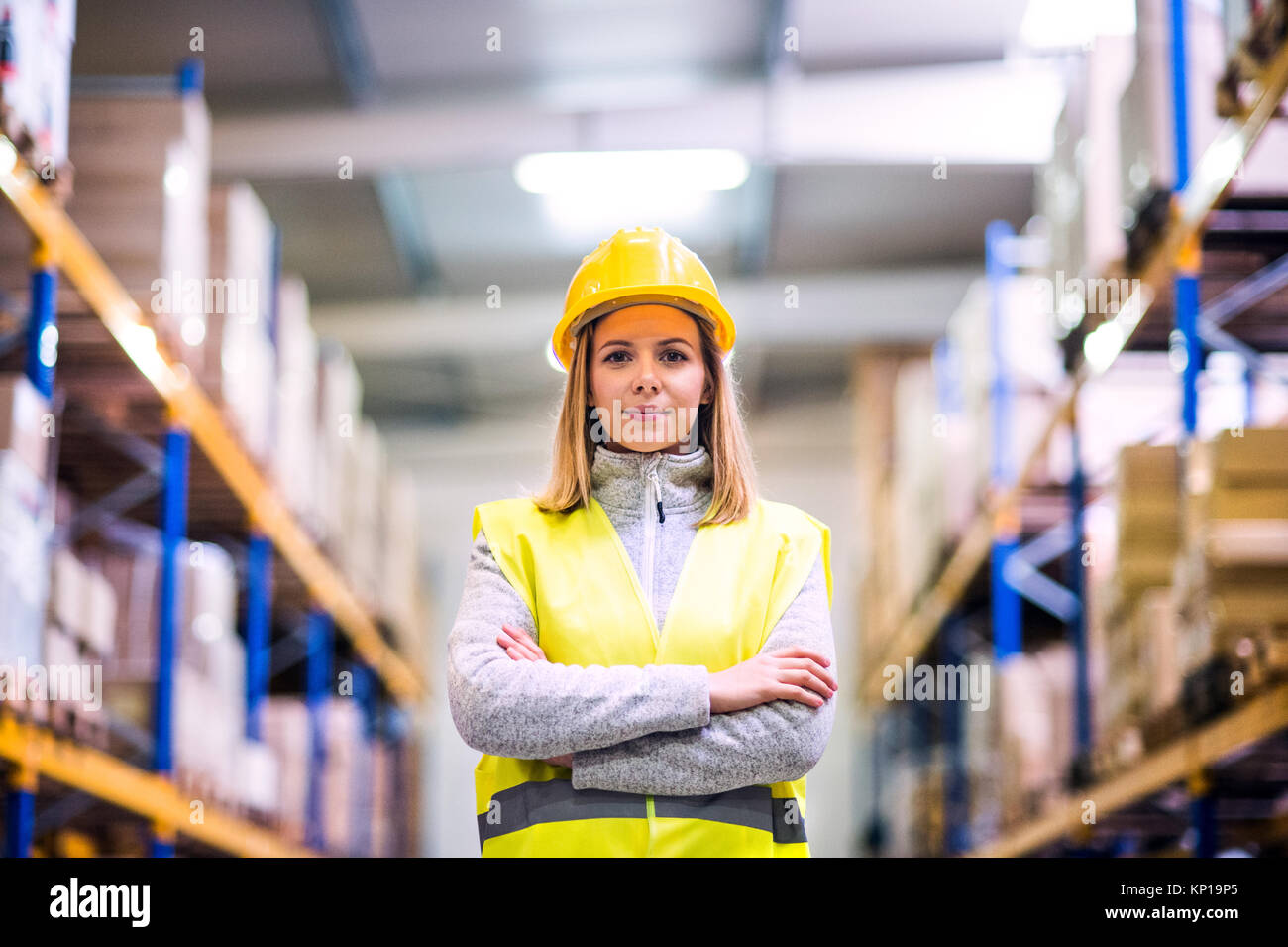 Portrait female warehouse standing arms hi-res stock photography and ...