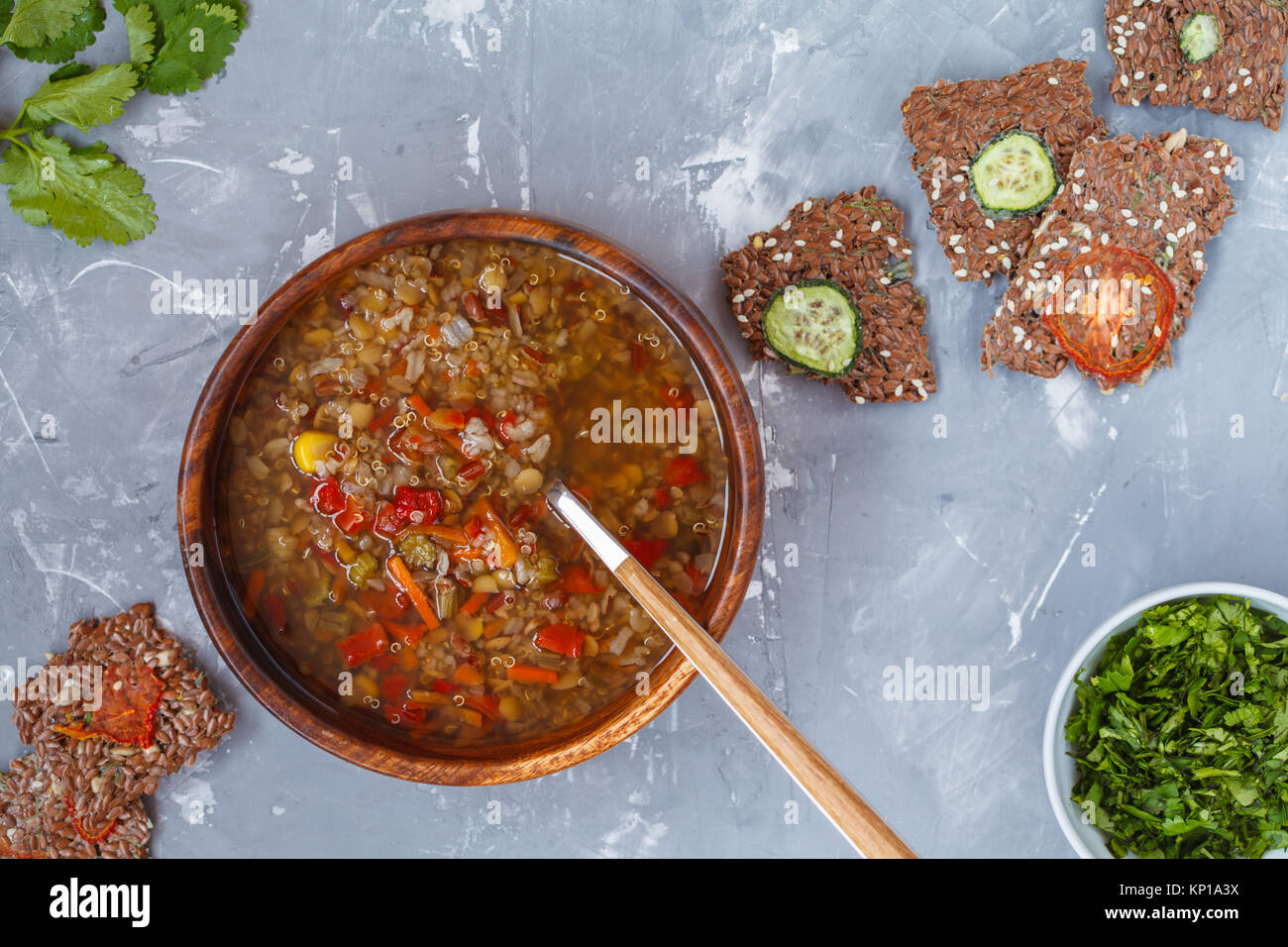 Peruvian soup with quinoa, red rice and lentils in a wooden bowl with ...