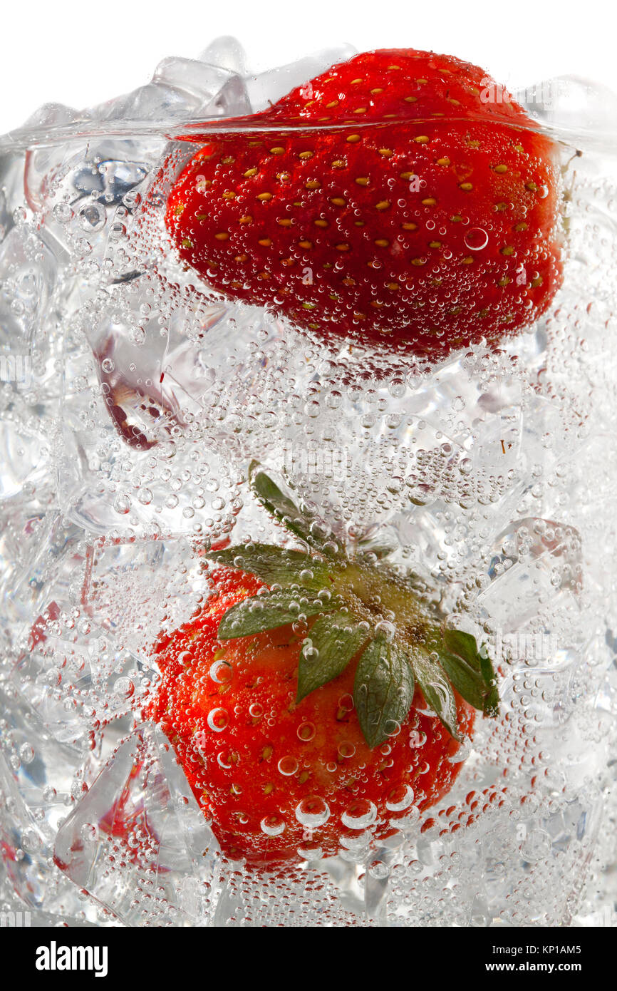 strawberries in ice cubes Stock Photo - Alamy