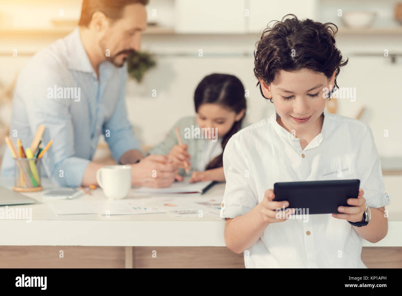 Nice smart boy using a tablet Stock Photo - Alamy