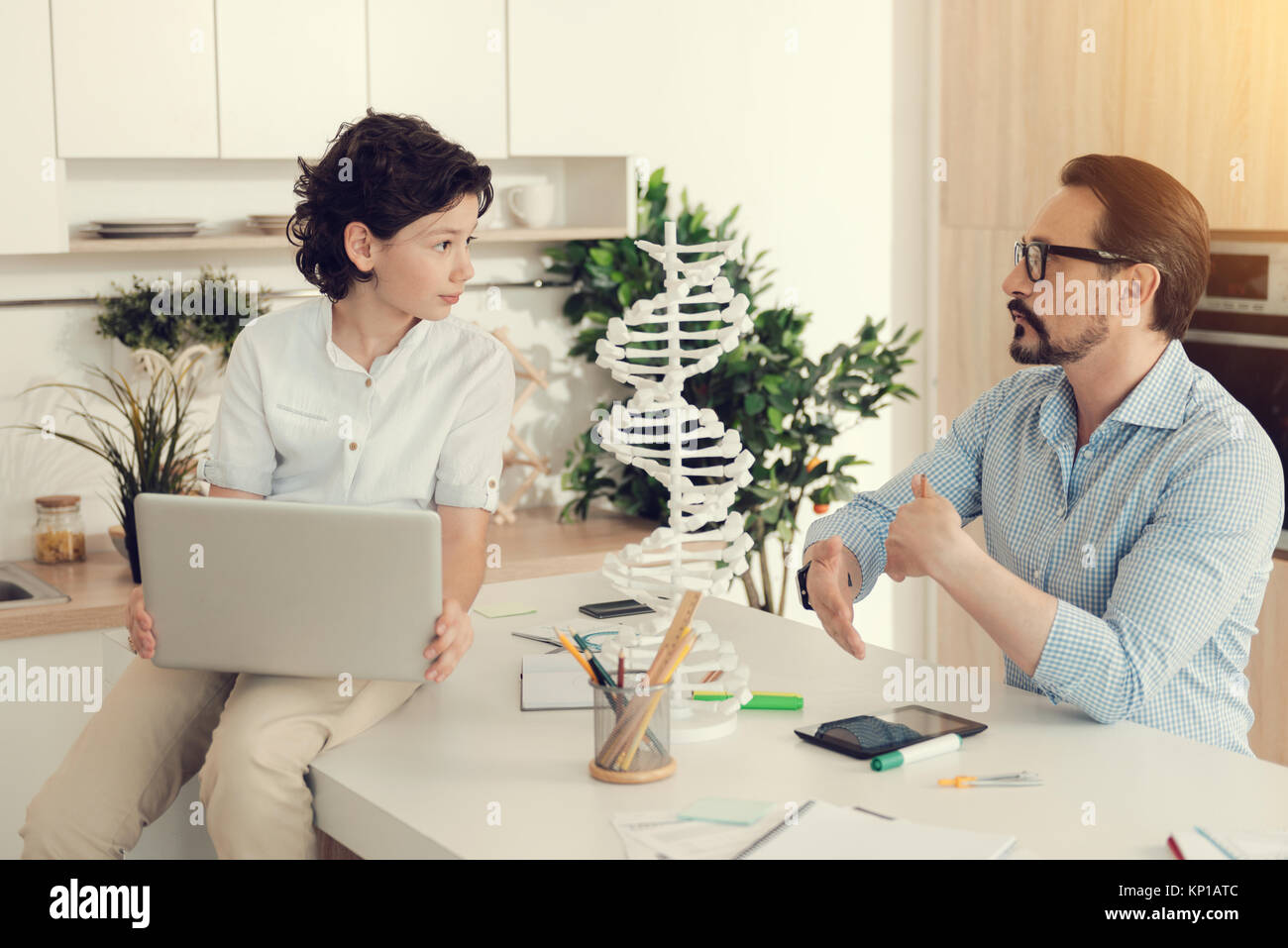 Curious smart boy sitting hi-res stock photography and images - Alamy