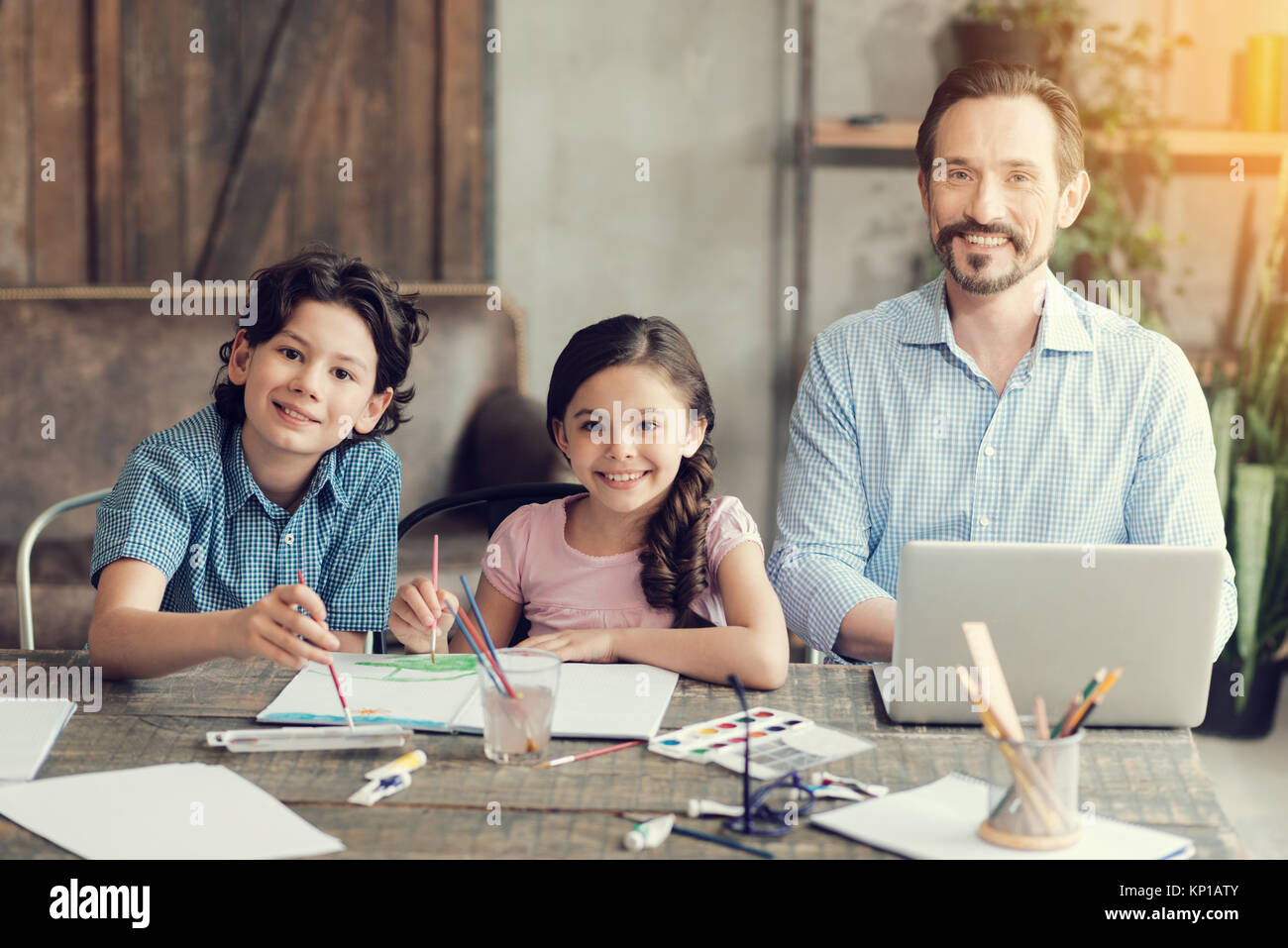Smart positive children painting Stock Photo - Alamy