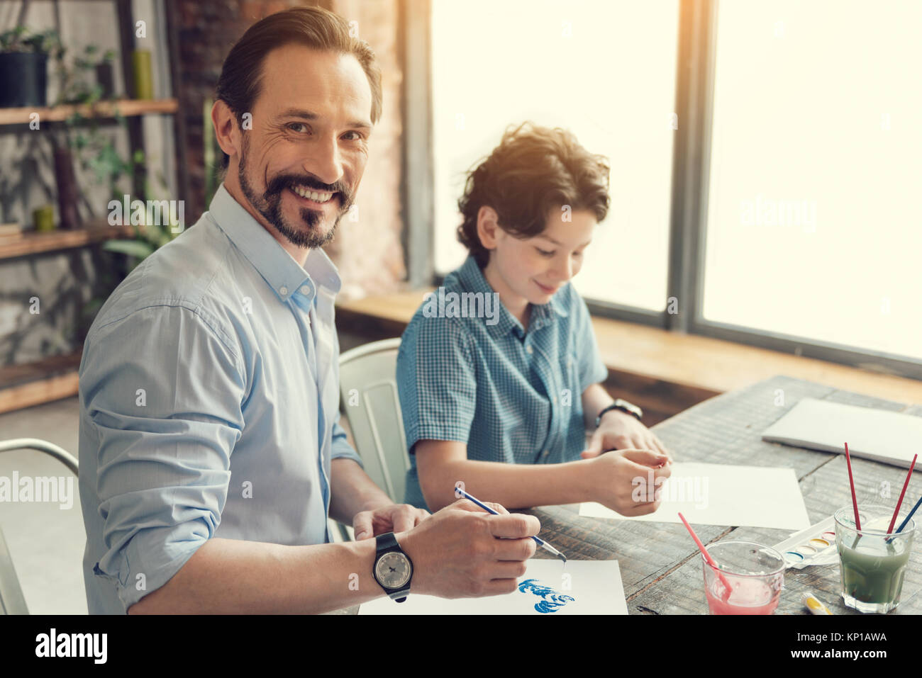 Happy creative man smiling Stock Photo - Alamy