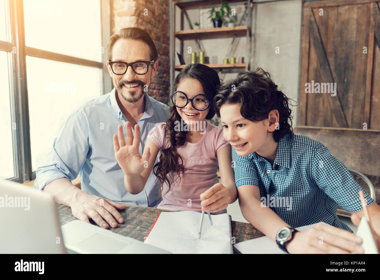 Happy smart girl waving her hand Stock Photo - Alamy