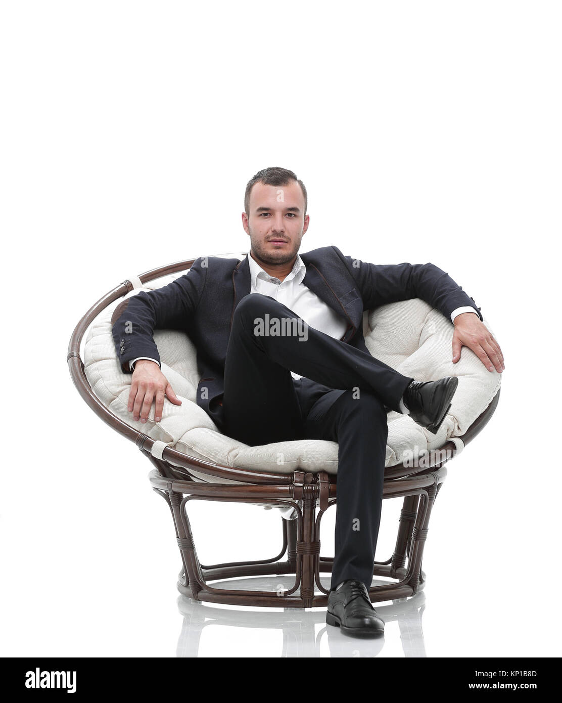 young businessman sitting in a comfortable chair Stock Photo - Alamy
