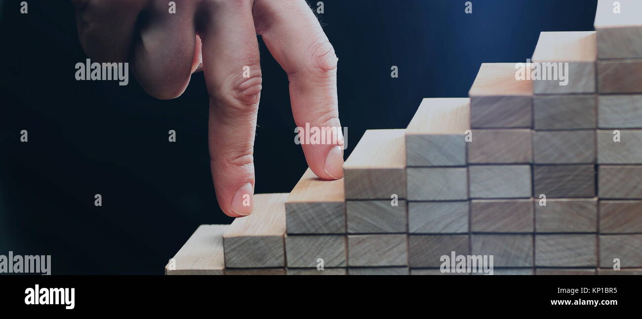 Hand climbing stairs made by wooden blocks Stock Photo - Alamy