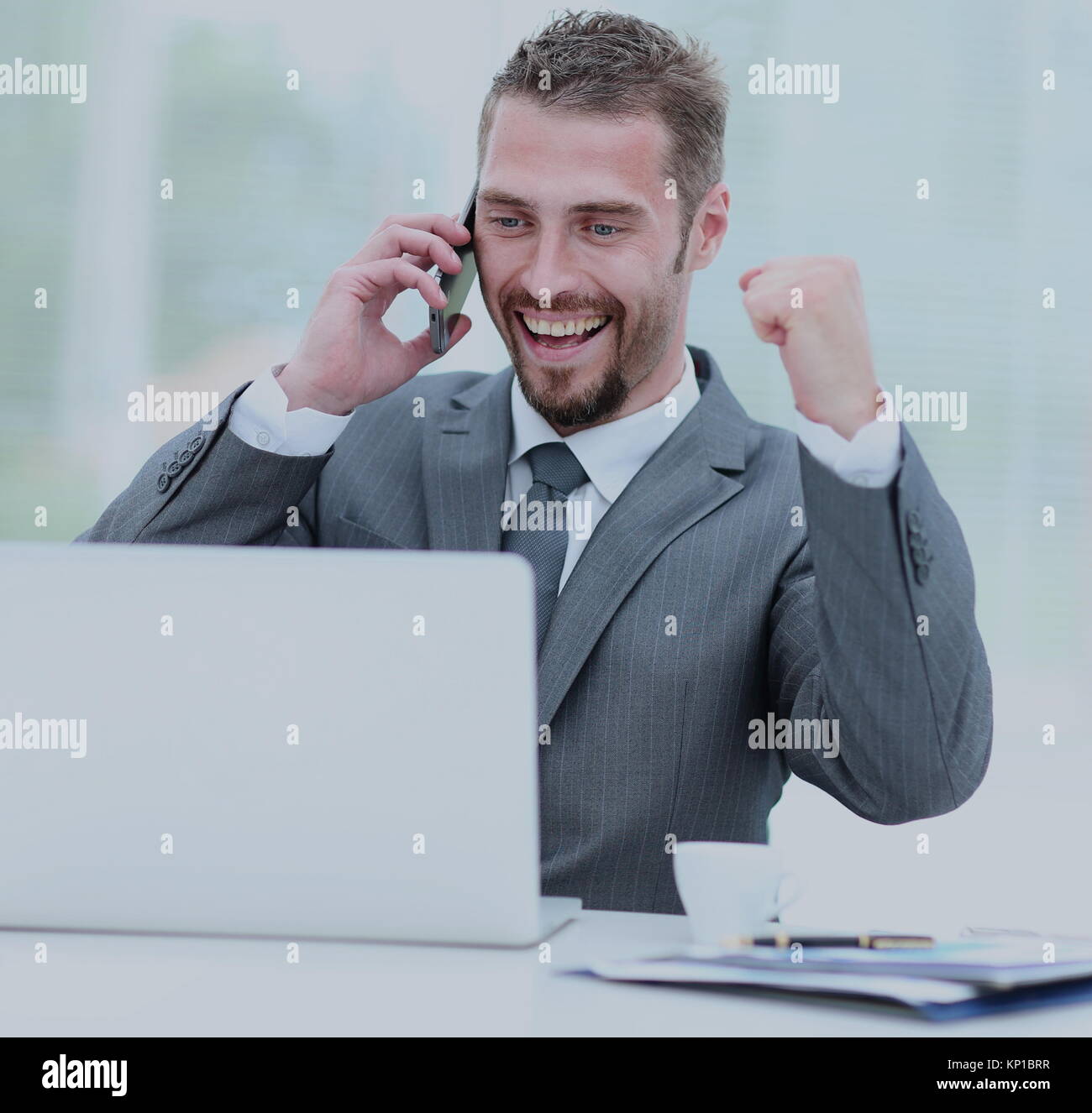 Happy smiling businessman working with laptop and calling Stock Photo ...