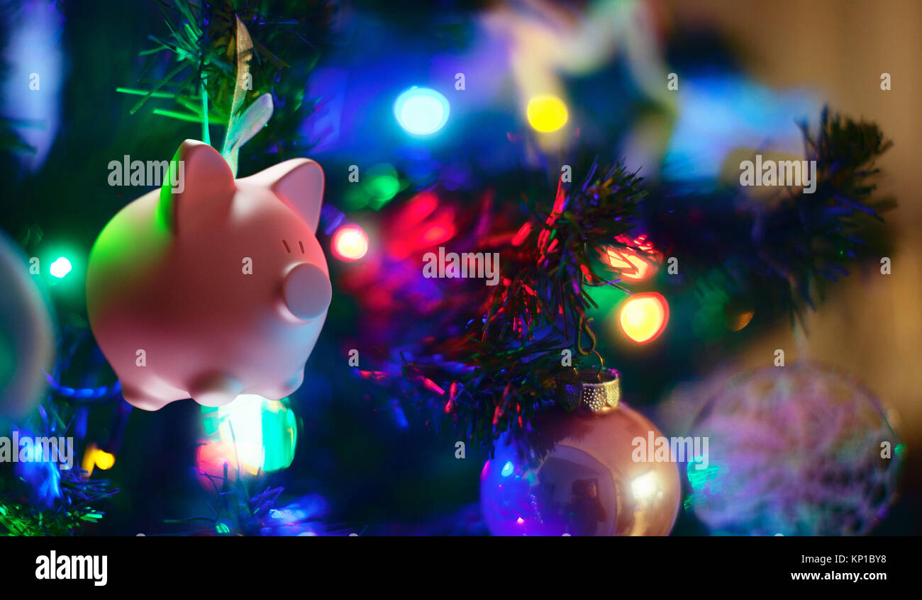 Piggy bank on christmas tree Stock Photo - Alamy