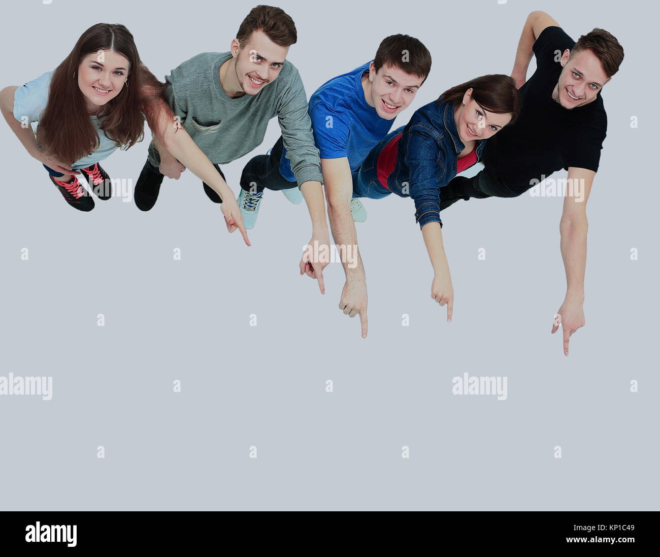 group of young people pointing at something Stock Photo - Alamy