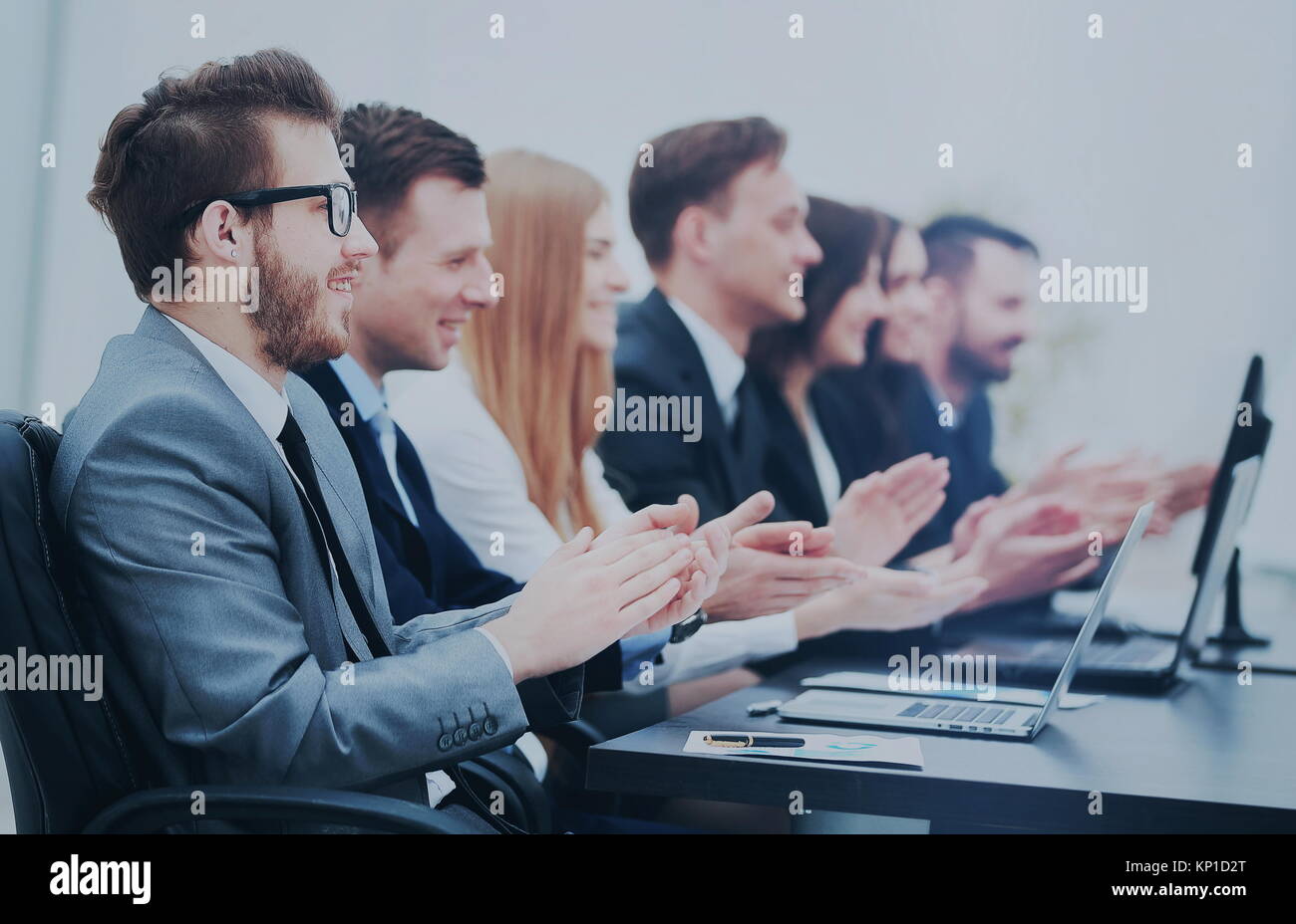 Photo of happy business people applauding at conference Stock Photo - Alamy