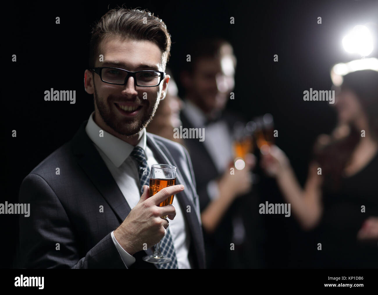 elegant man raising his glass with the toast Stock Photo - Alamy