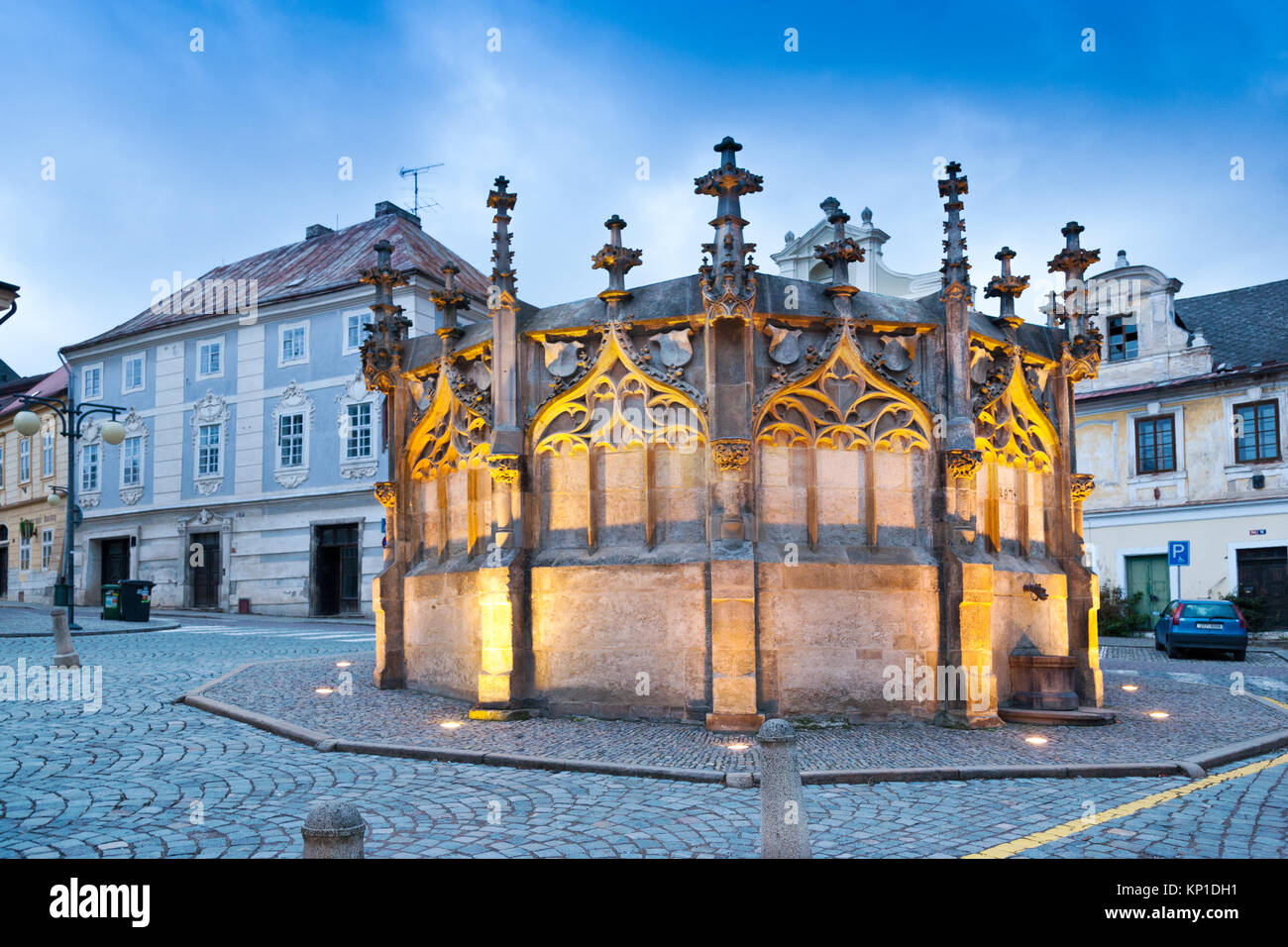gothic water well from 1495 and baroque St. Nepomuk church from 1734 ...