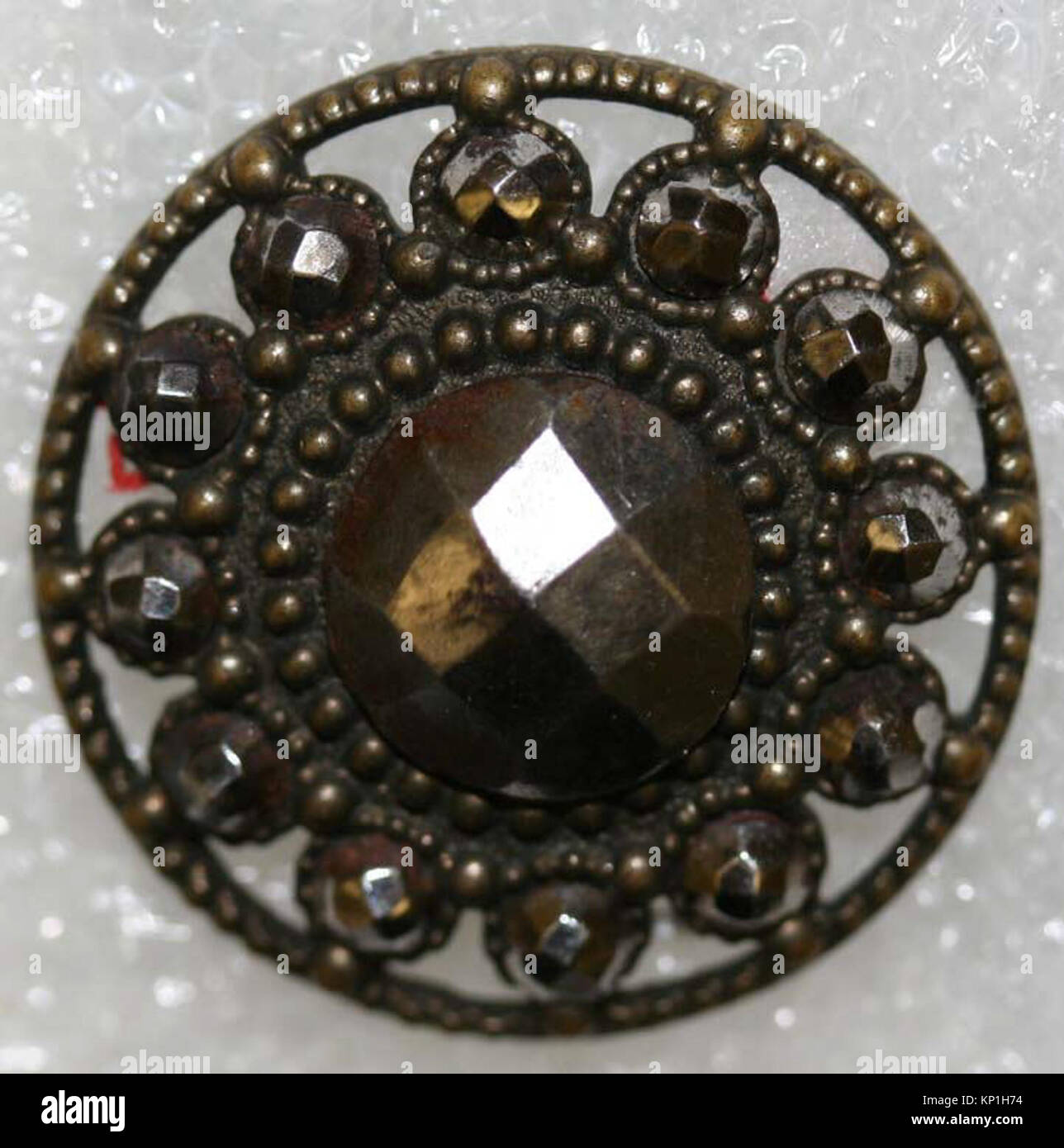 An illustrated book cataloged MET 51.47.1815 presenting a button on the ...