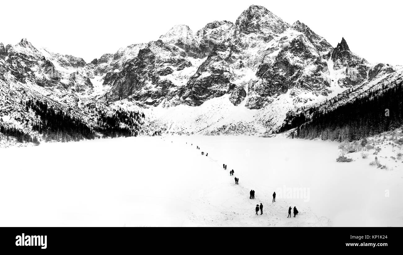Black and white winter landscape of frozen Morskie Oko Lake and snowy ...