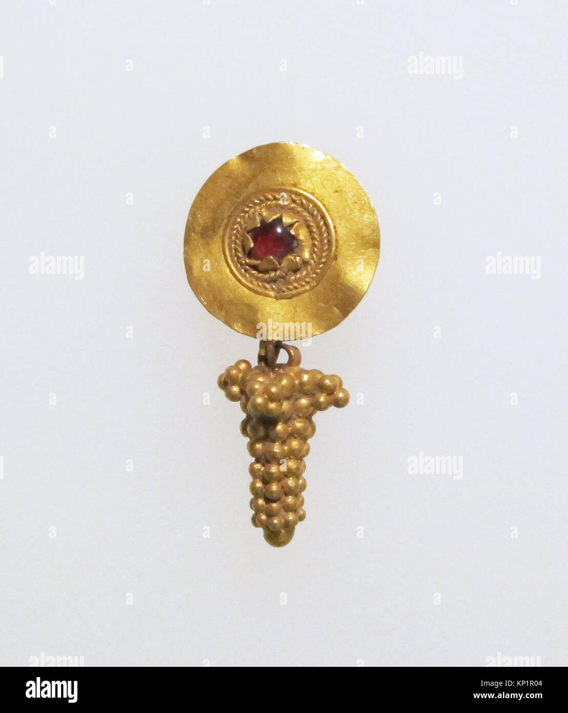 A MET gold earring, catalog sf9515197, with a decorative disc and grape ...