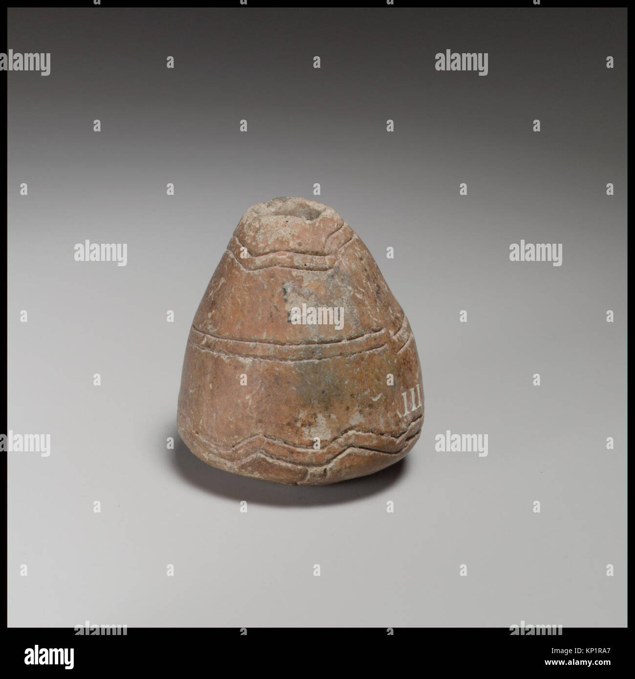 Conical-hemispherical spindle-whorl with slightly rounded base MET ...