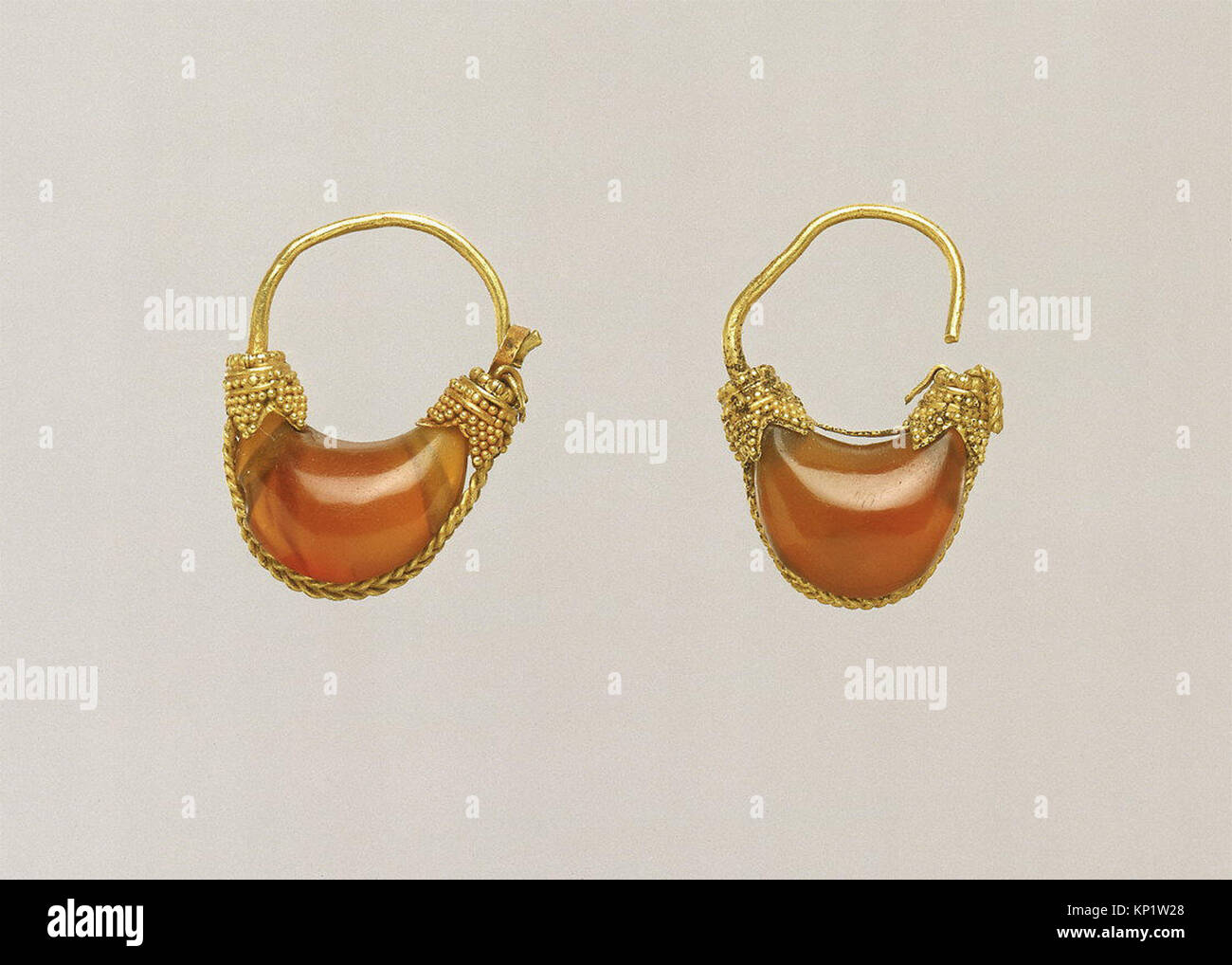A gold and carnelian boat-shaped earring from the MET collection ...