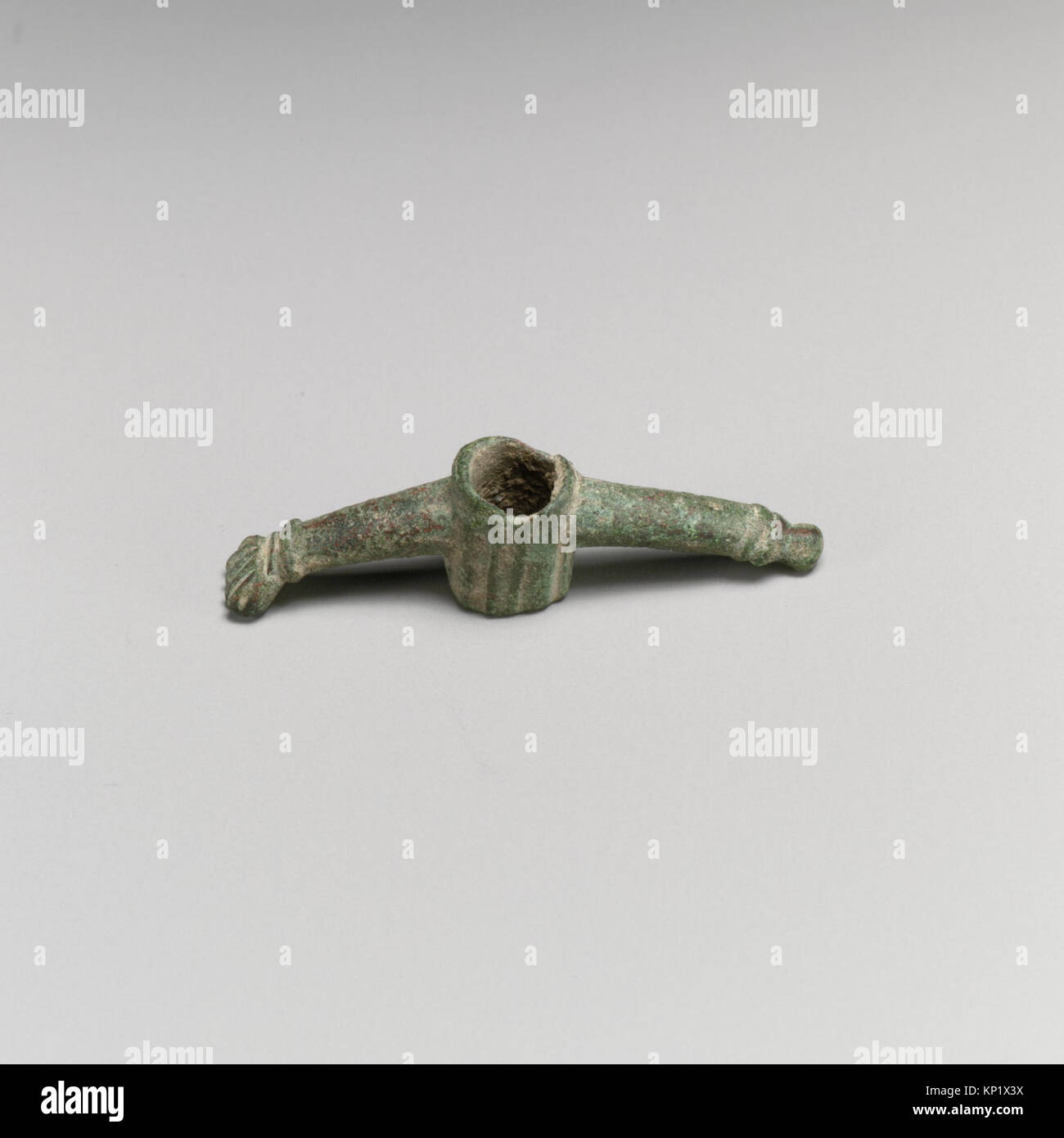 This 1st-century Roman bronze amulet features a phallus and scrotum ...