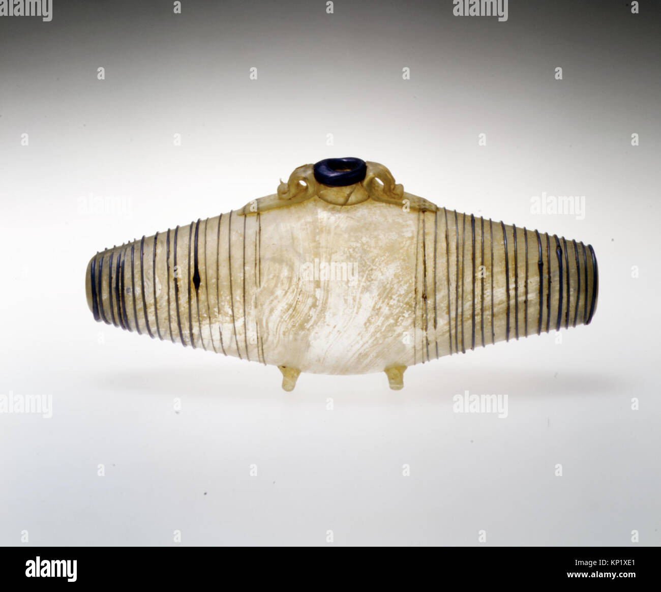 A preserved glass barrel-shaped jug illustrating ancient glassmaking ...