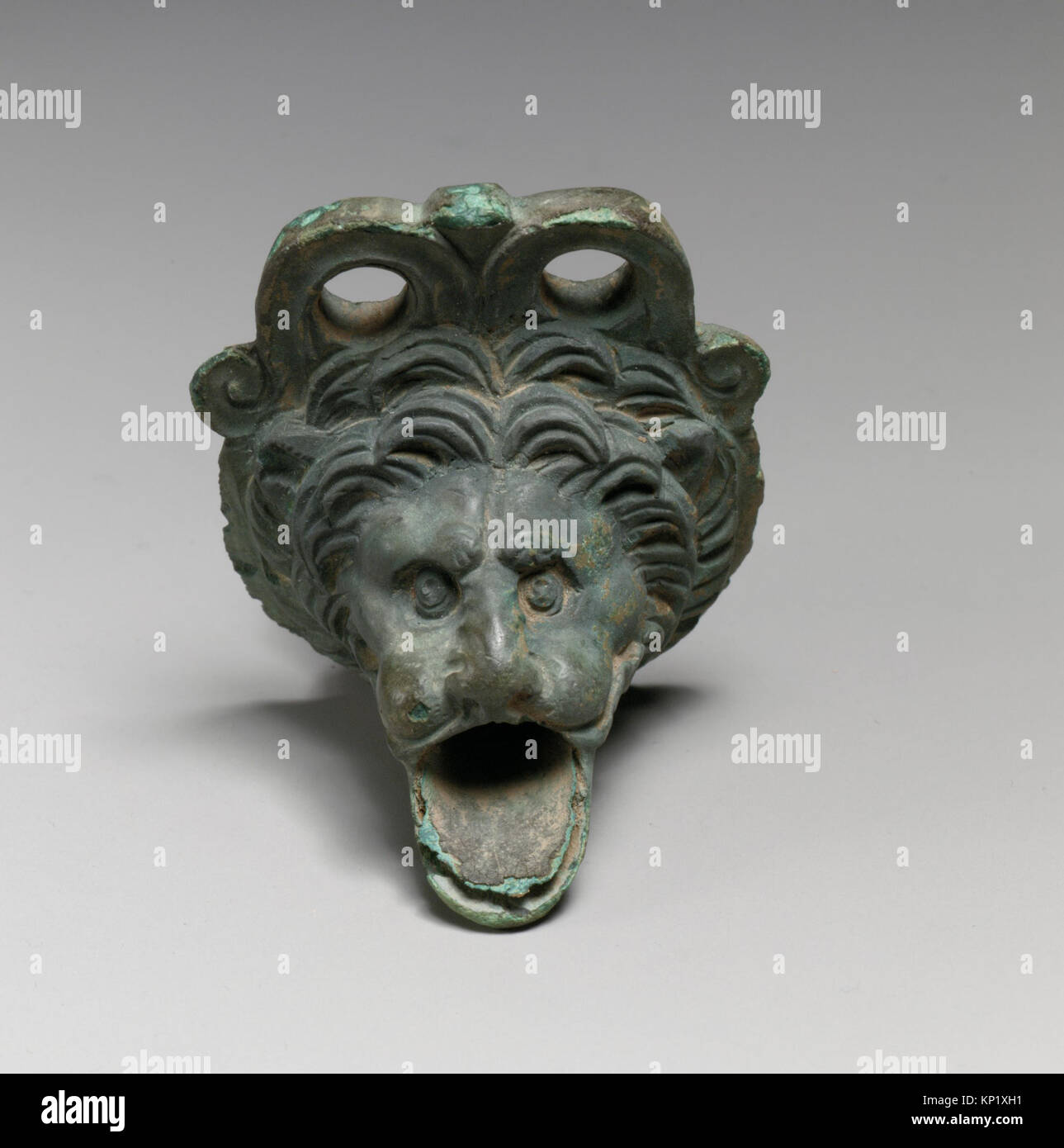 A 4th-century B.C. Greek bronze spout depicting a lion’s head ...