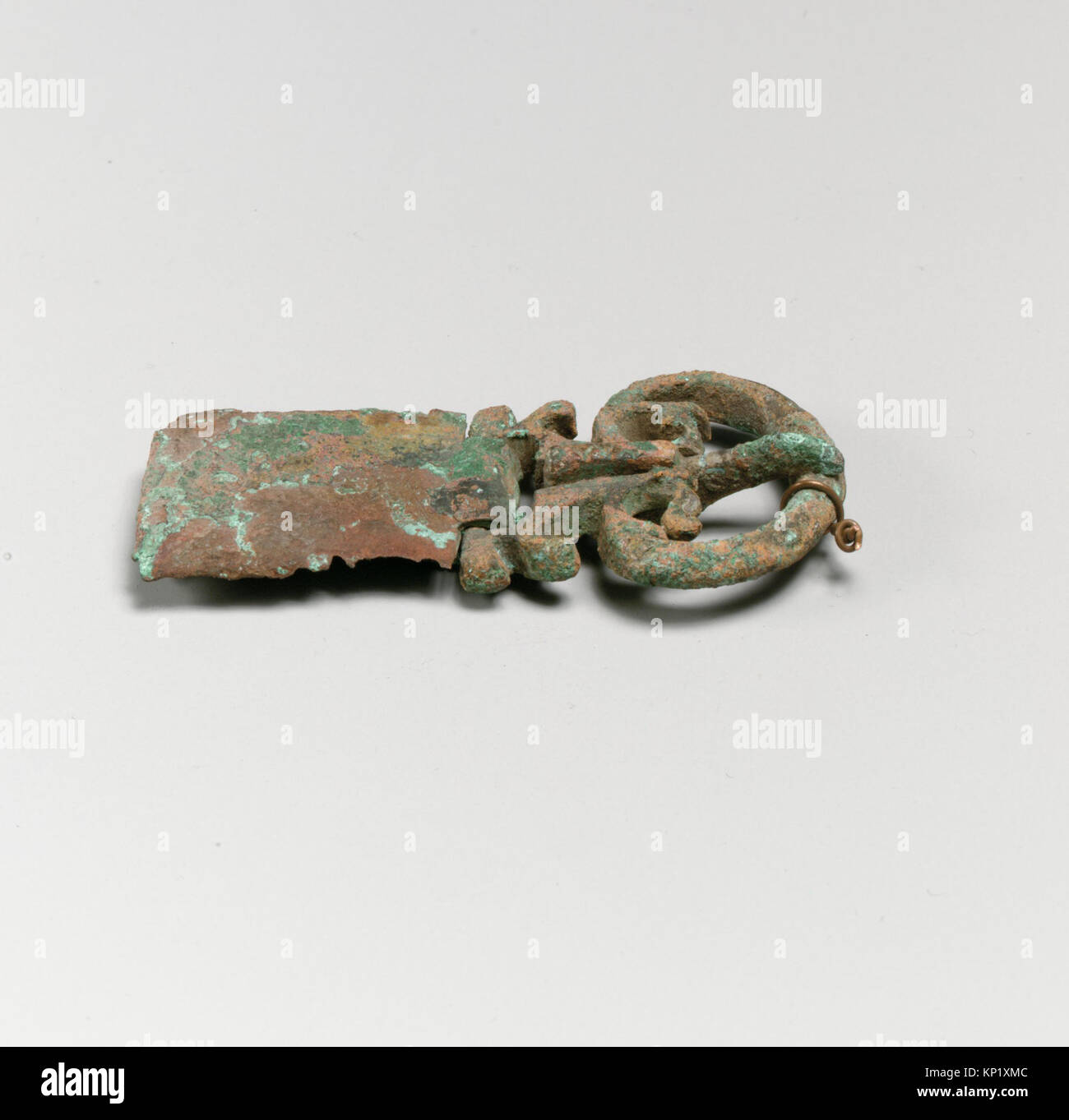Rectangular metal buckle from ancient period, featuring central pin and ...