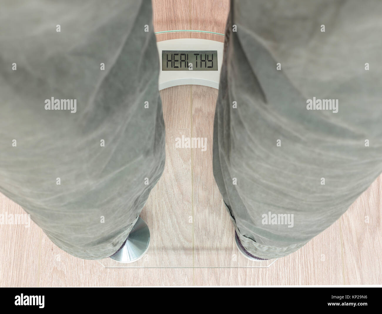 Closeup of man's feet on weight scale - Healthy Stock Photo - Alamy