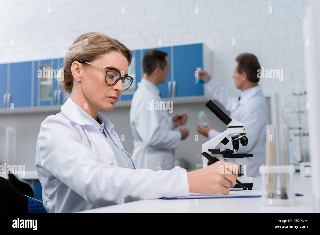 lab technician taking notes Stock Photo - Alamy